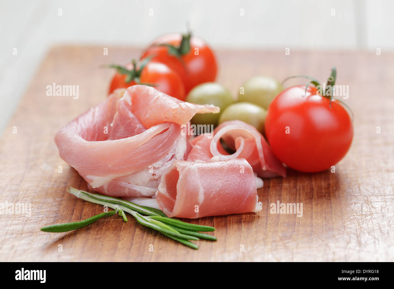 dried jamon slices on wood table, spanish traditional food Stock Photo ...
