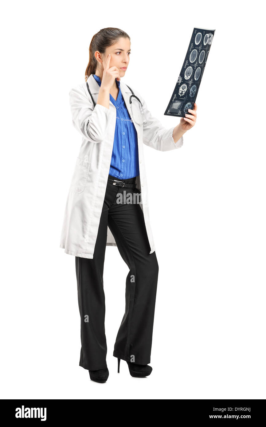 Full length portrait of a female doctor analyzing an x-ray Stock Photo ...