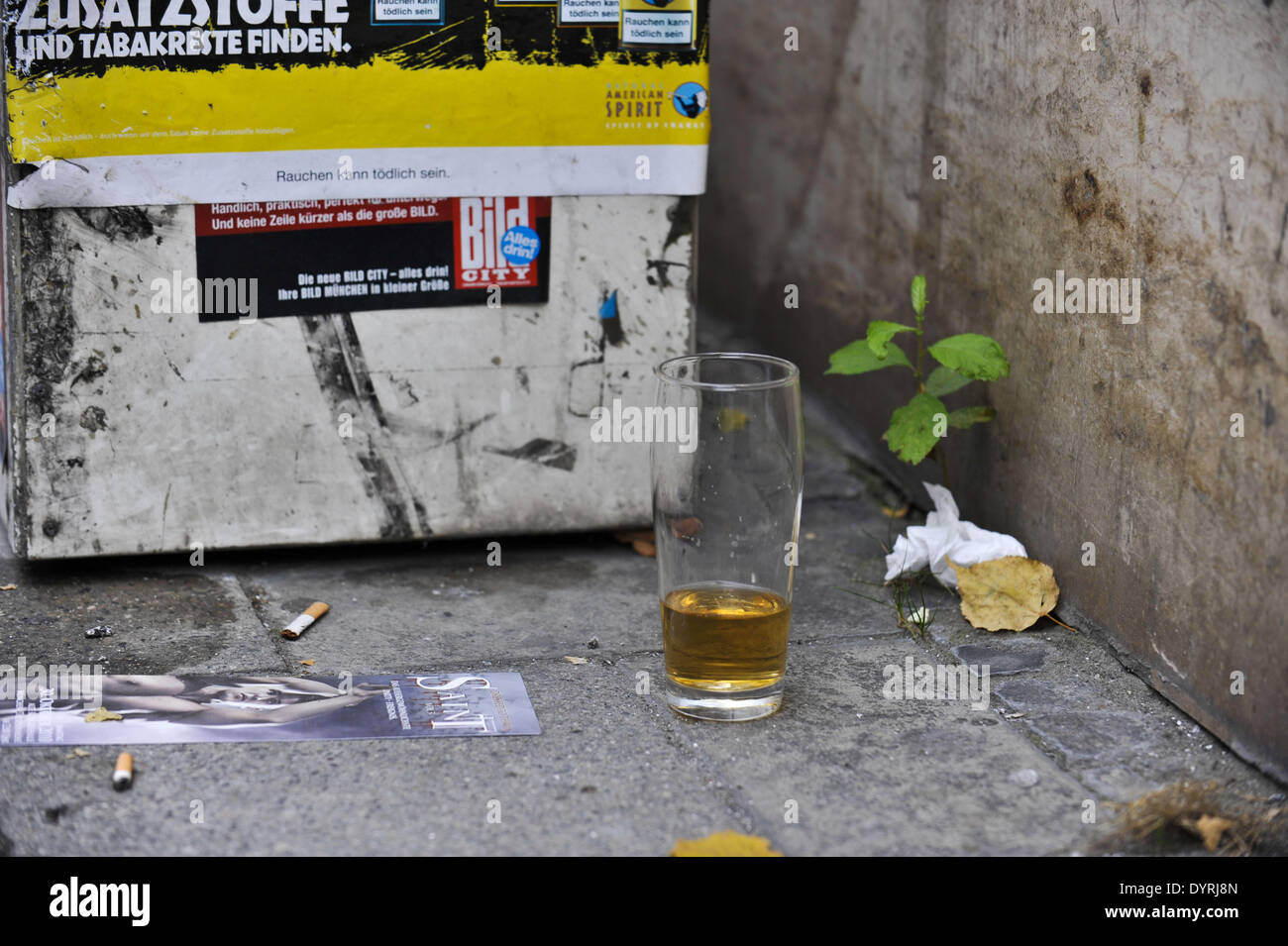 Half-empty beer glass on the street in Munich, 2011 Stock Photo - Alamy