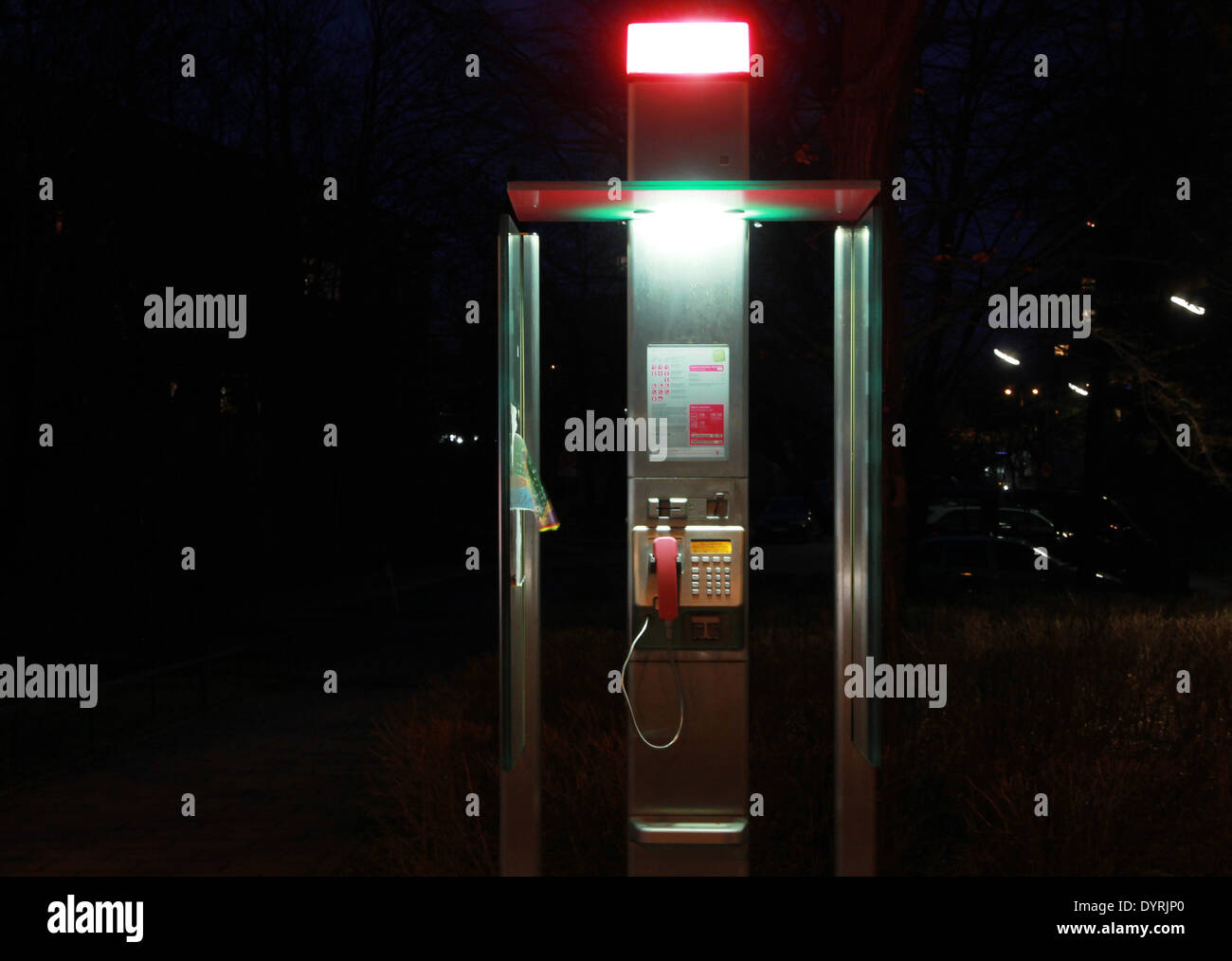 Phone booth at night in Munich, 2011 Stock Photo - Alamy
