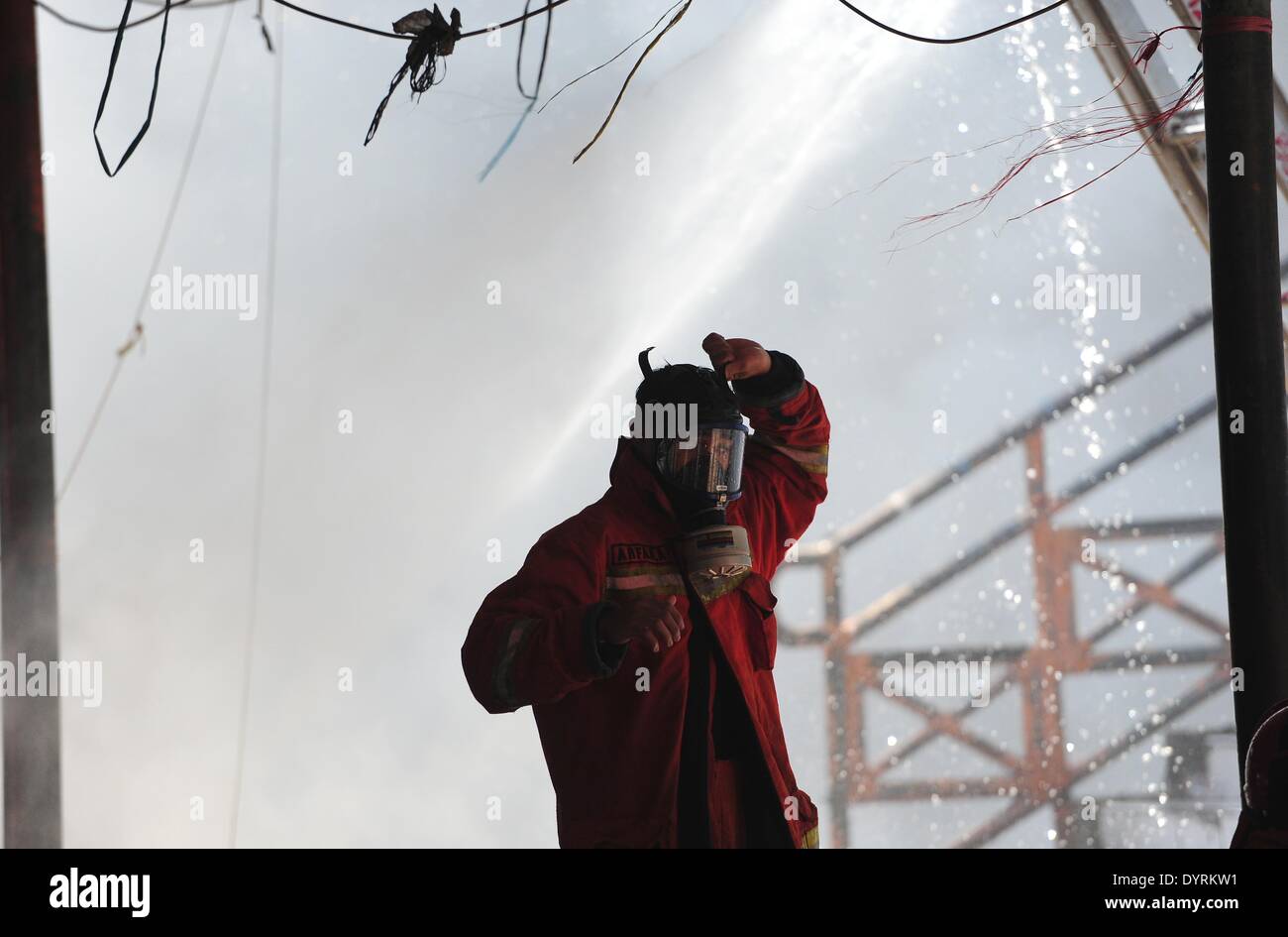 Jakarta, Indonesia. 25th Apr, 2014. An Indonesian firefighter stands at ...