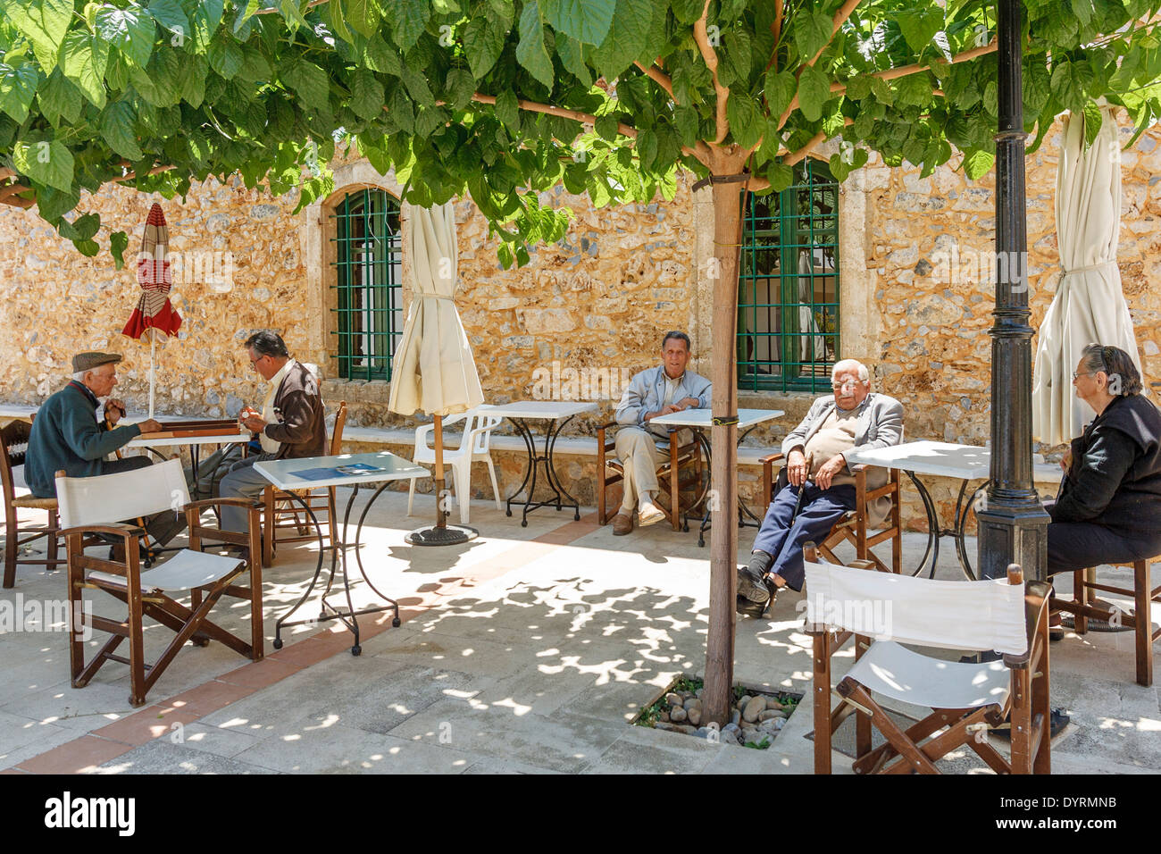 Elderly Greek People Sitting In The Main Square of Malia, Crete, Greece ...