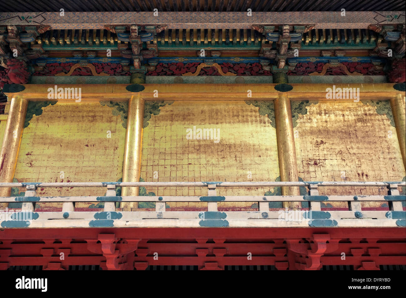 golden painted wall and wooden handrails of ancient Japanese temple ...