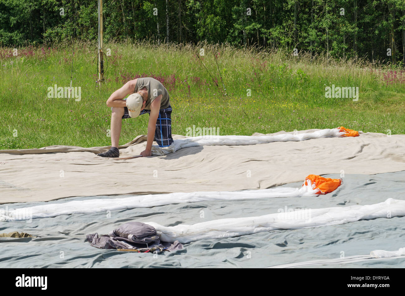 One day with parachutist in airfield. Parachute packing Stock Photo - Alamy