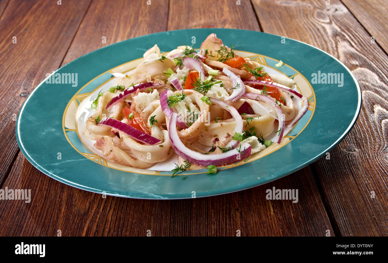 Calamari in padella. mediterranean cuisine.roasted squids with ...