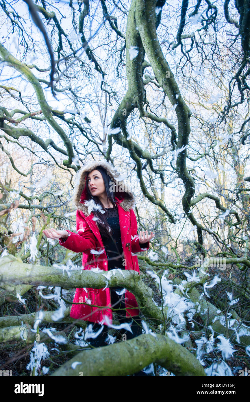 Little red riding hood: A tall slender young woman girl alone in ...