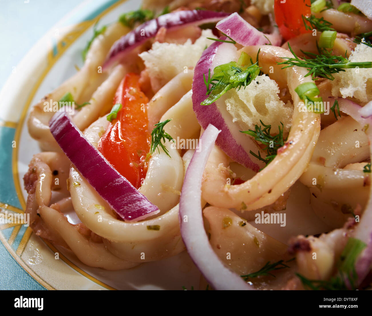 Calamari in padella. mediterranean cuisine.roasted squids with ...