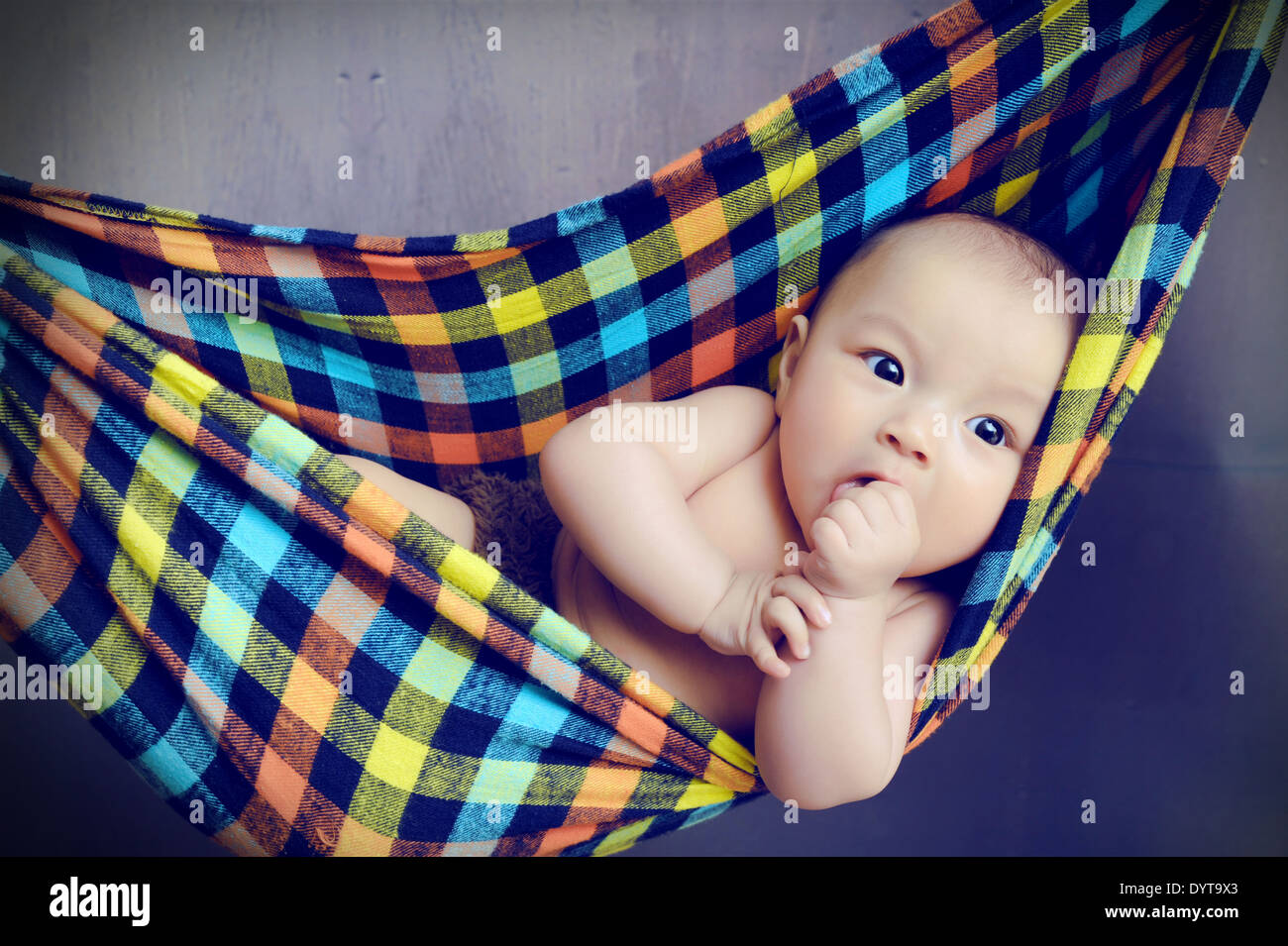 Baby in a cradle Stock Photo - Alamy