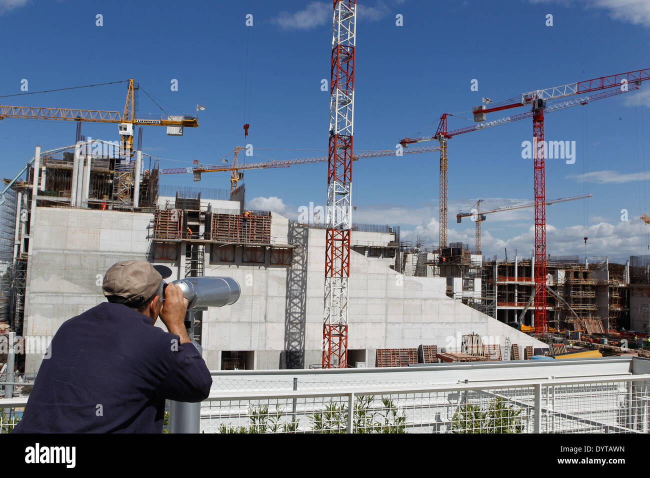 Athens, Greece. 25th Apr, 2014. Cranes operate at the construction site ...