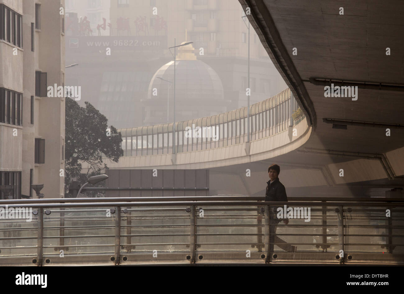 A man walk on a flyover in downtown Stock Photo - Alamy