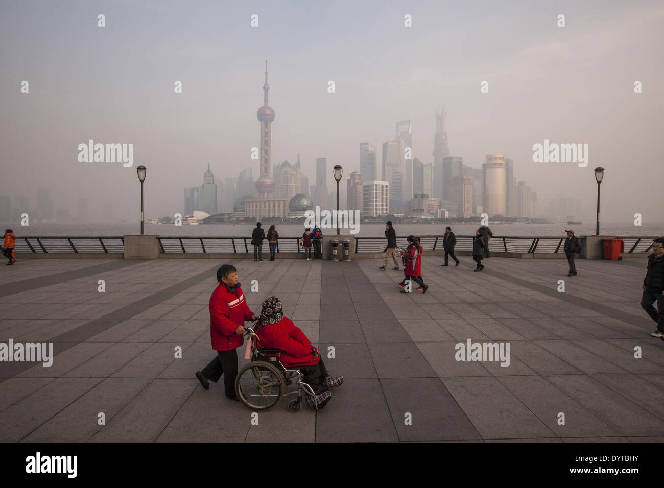 People walk at the bund with smog cover the city hi-res stock ...