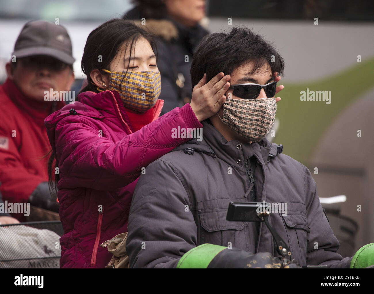 Woman adjust mask of man on motorcycle hi-res stock photography and ...