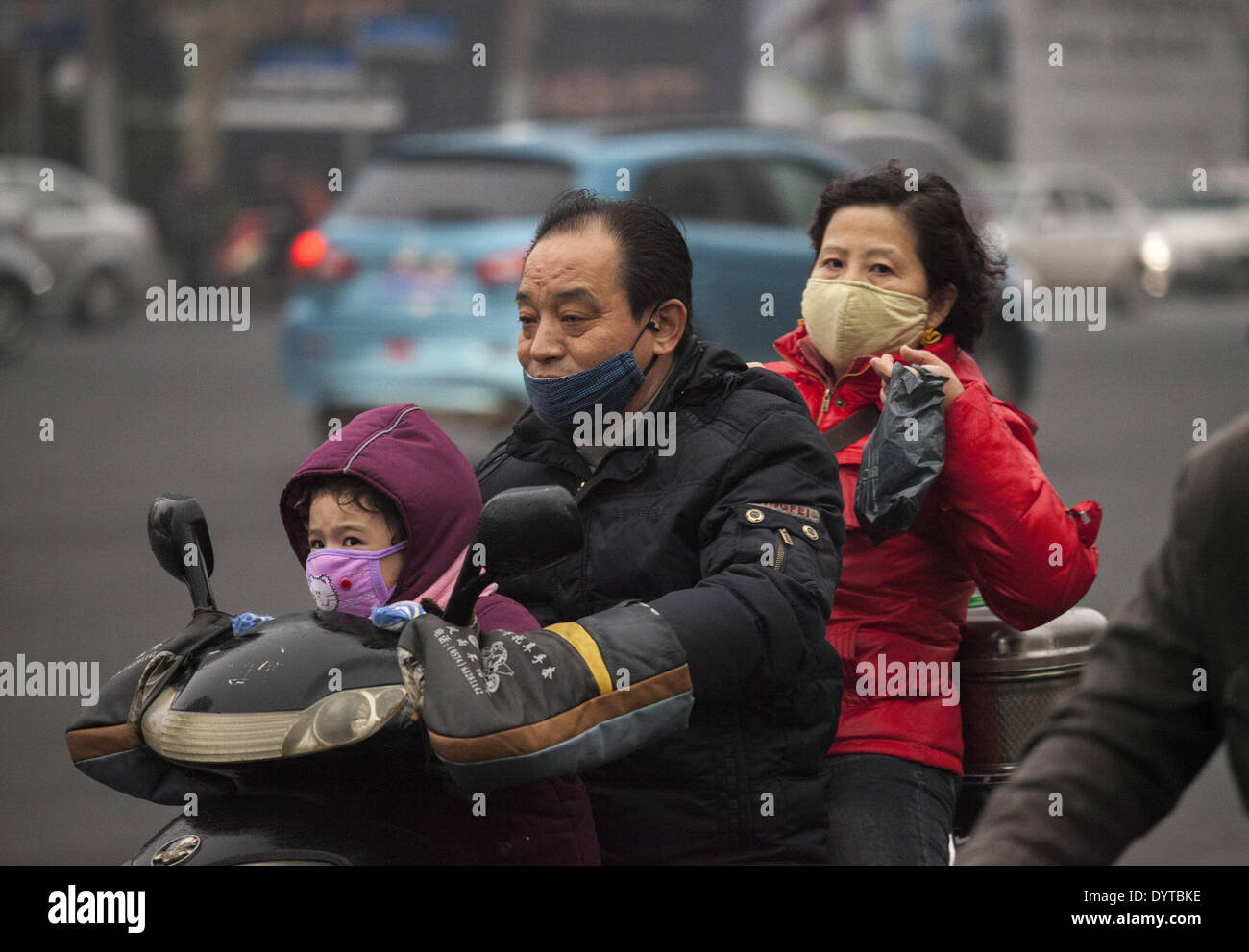A family wear mask ride on a motorcycle in Shanghai Stock Photo - Alamy