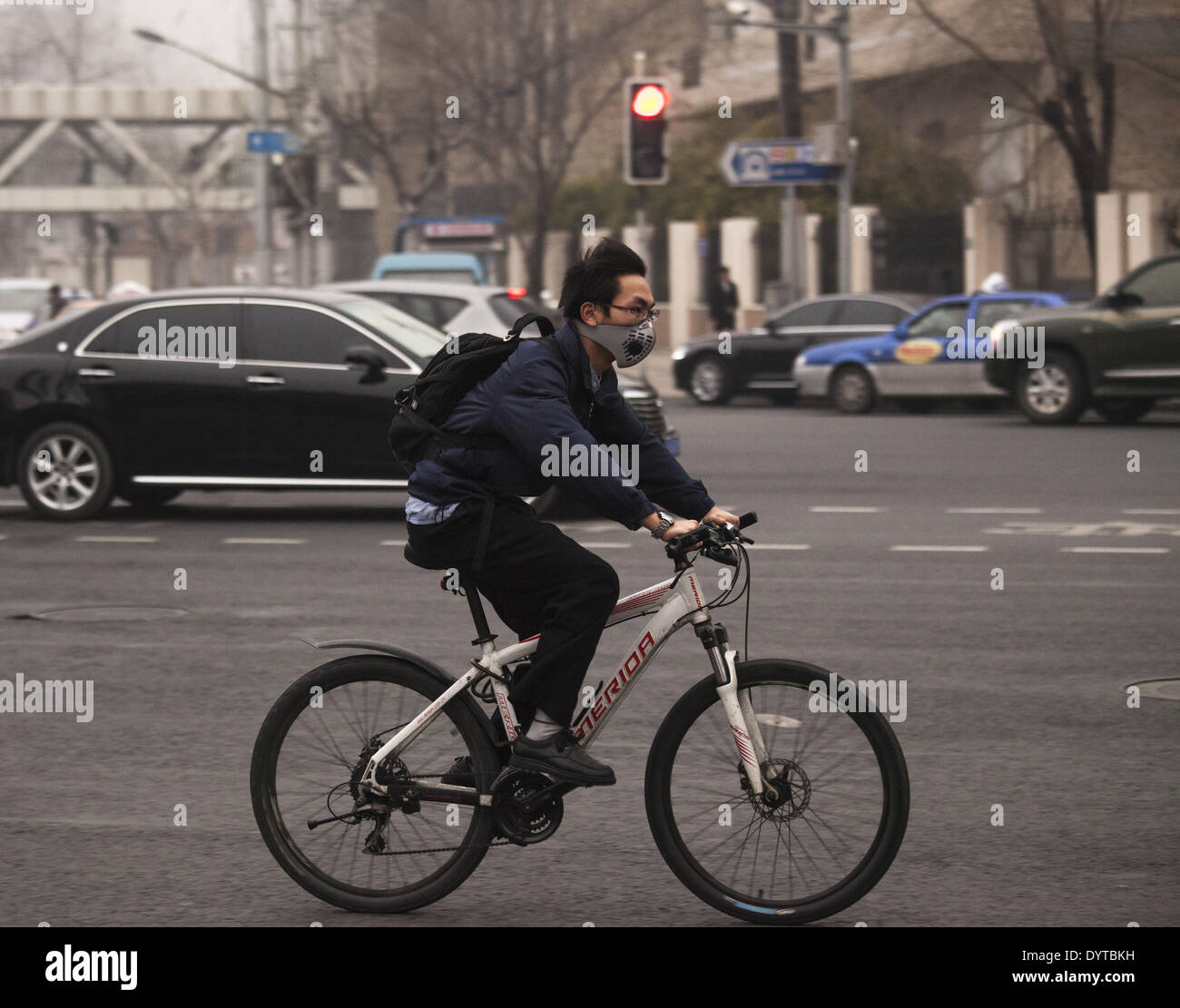 A cyclist wears a mask ride on a road Stock Photo - Alamy