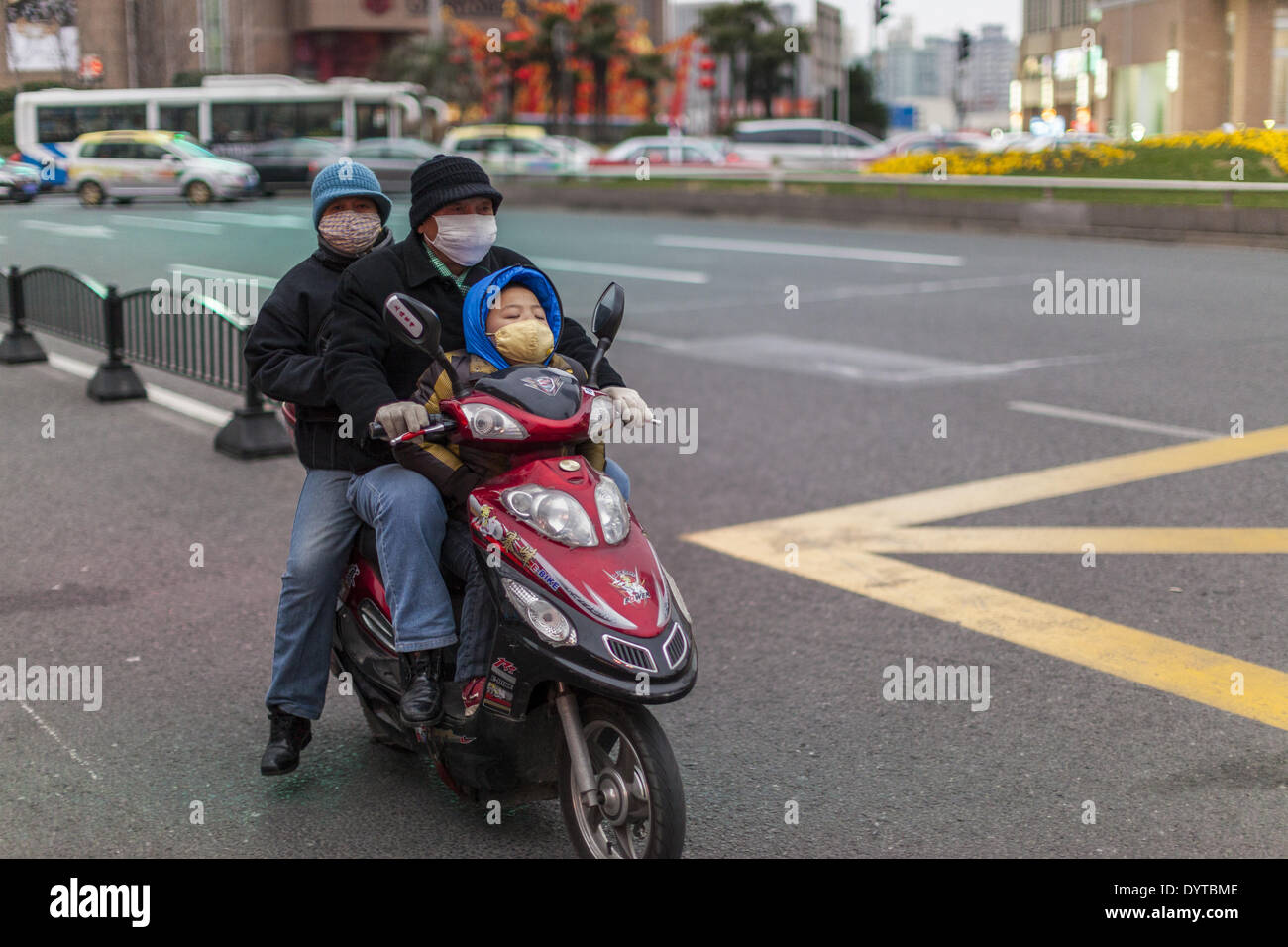 Three people wear mask ride on a motorcycle on a road Stock Photo - Alamy