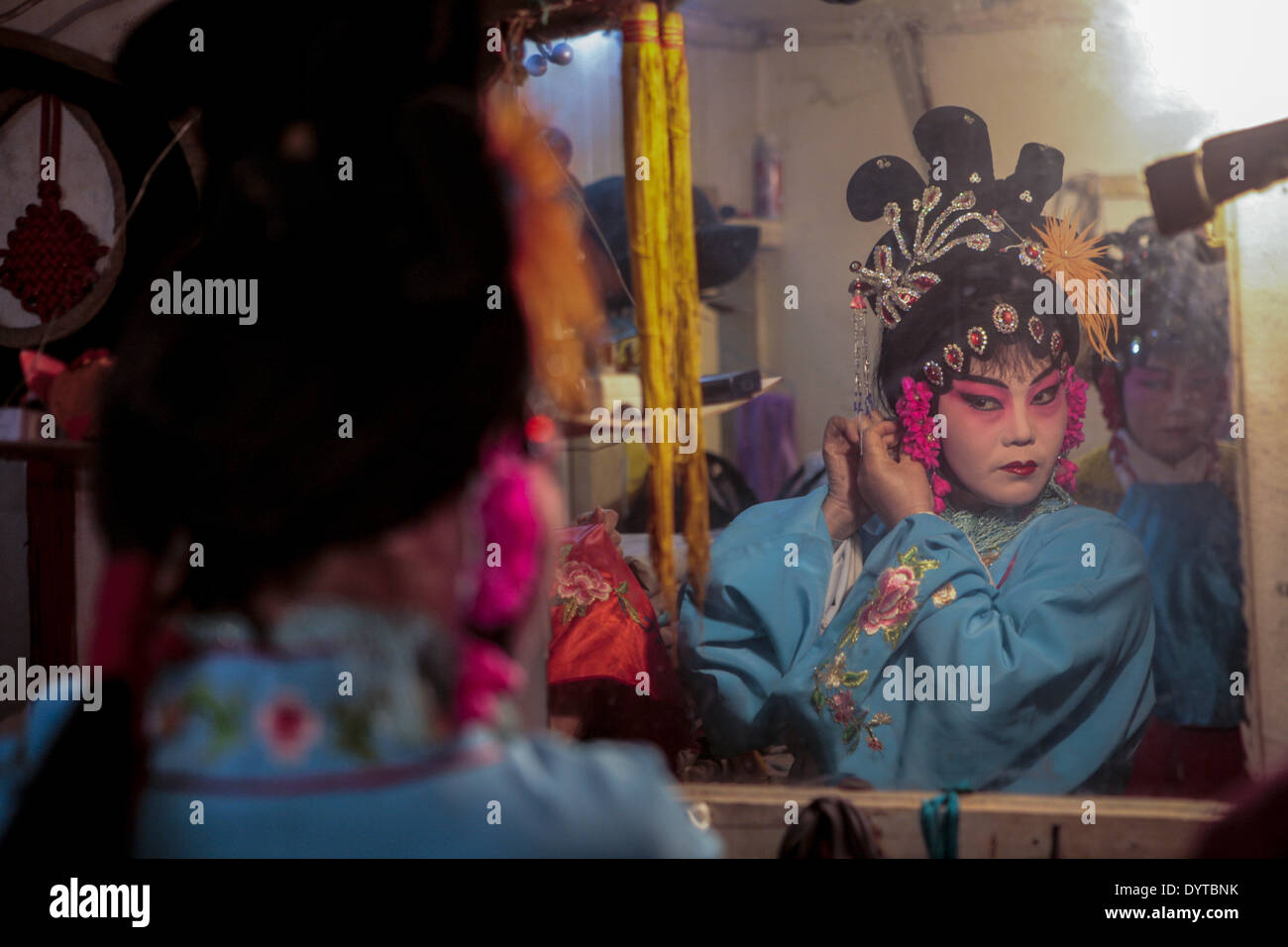 Chinese traditional opera artists do their makeup before their daily ...