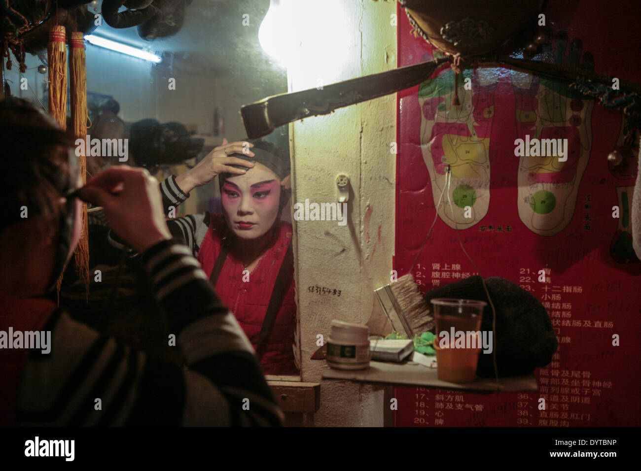 Chinese traditional opera artists do their makeup before their daily ...