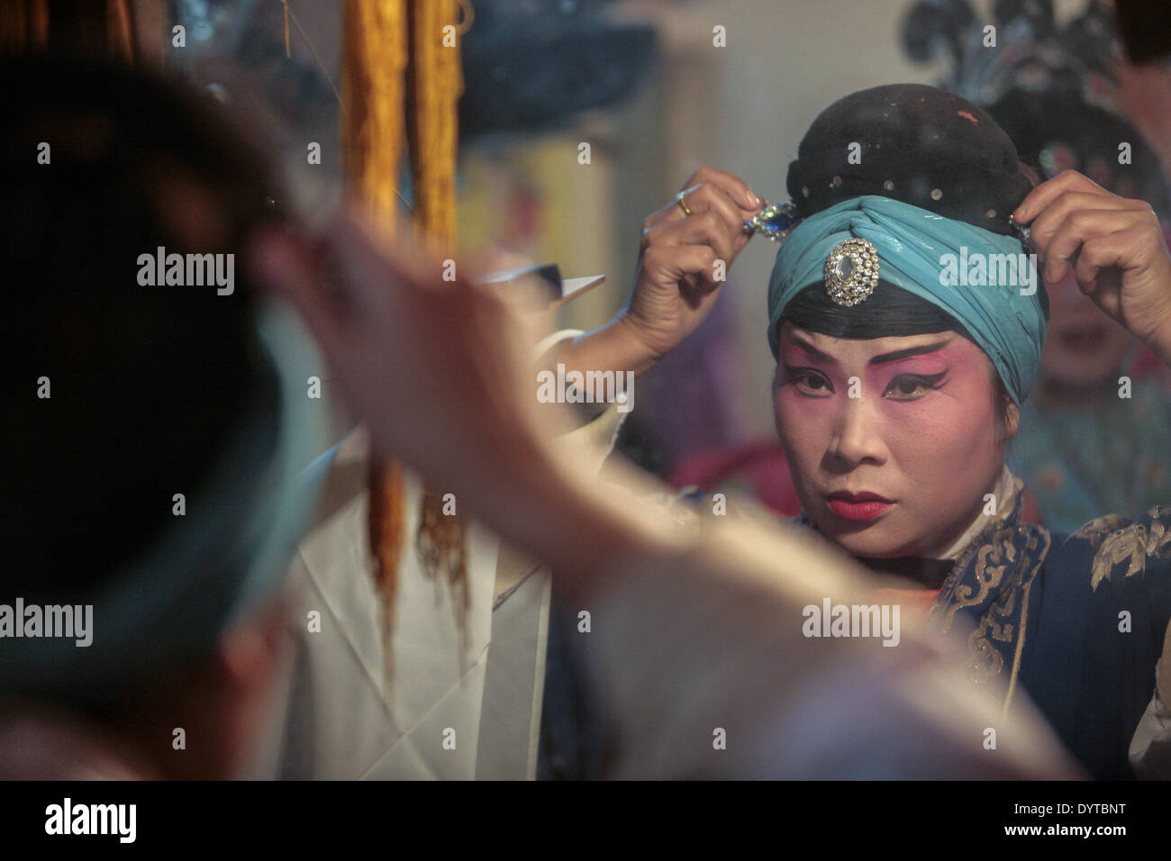 Chinese traditional opera artists do their makeup before their daily ...