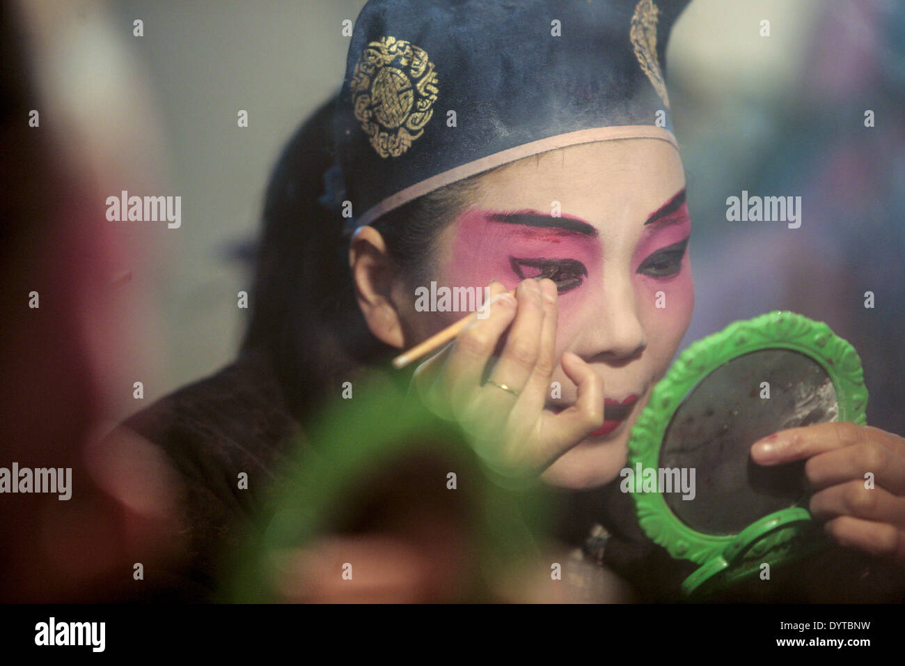 Chinese traditional opera artists do their makeup before their daily ...