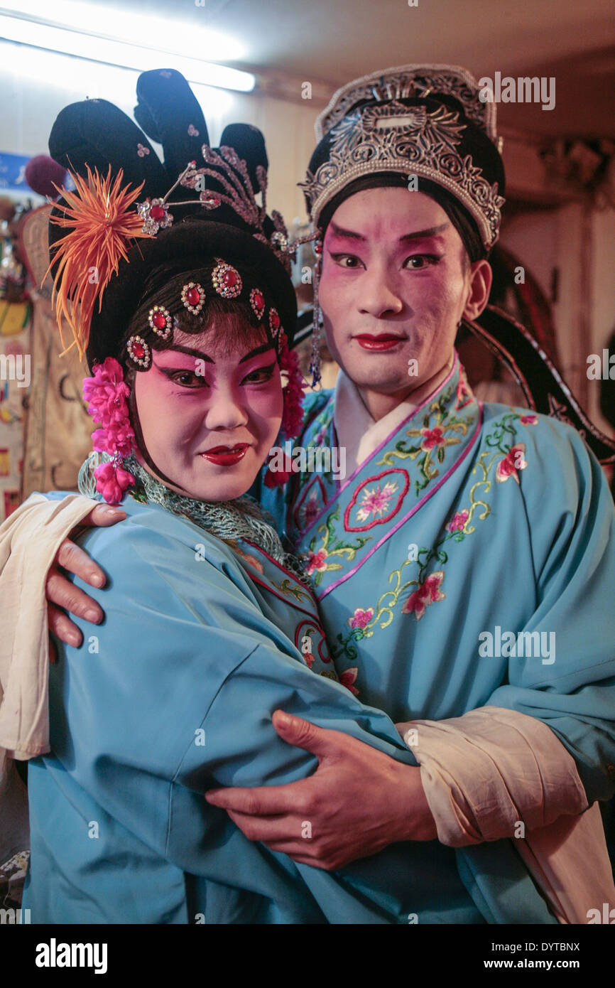 Chinese traditional opera artists pose for a picture before their daily ...