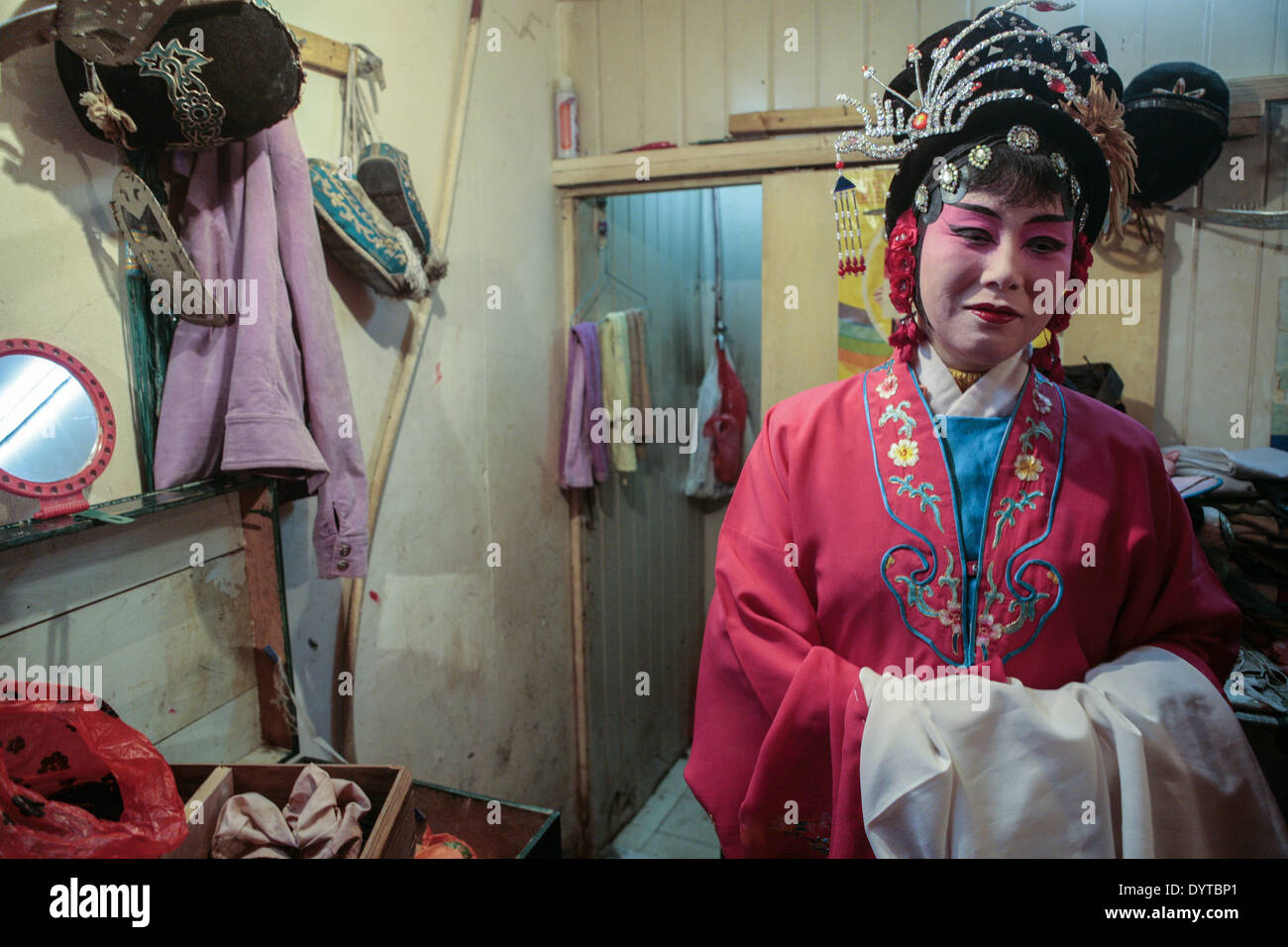 Chinese traditional opera artists pose for a picture before their daily ...