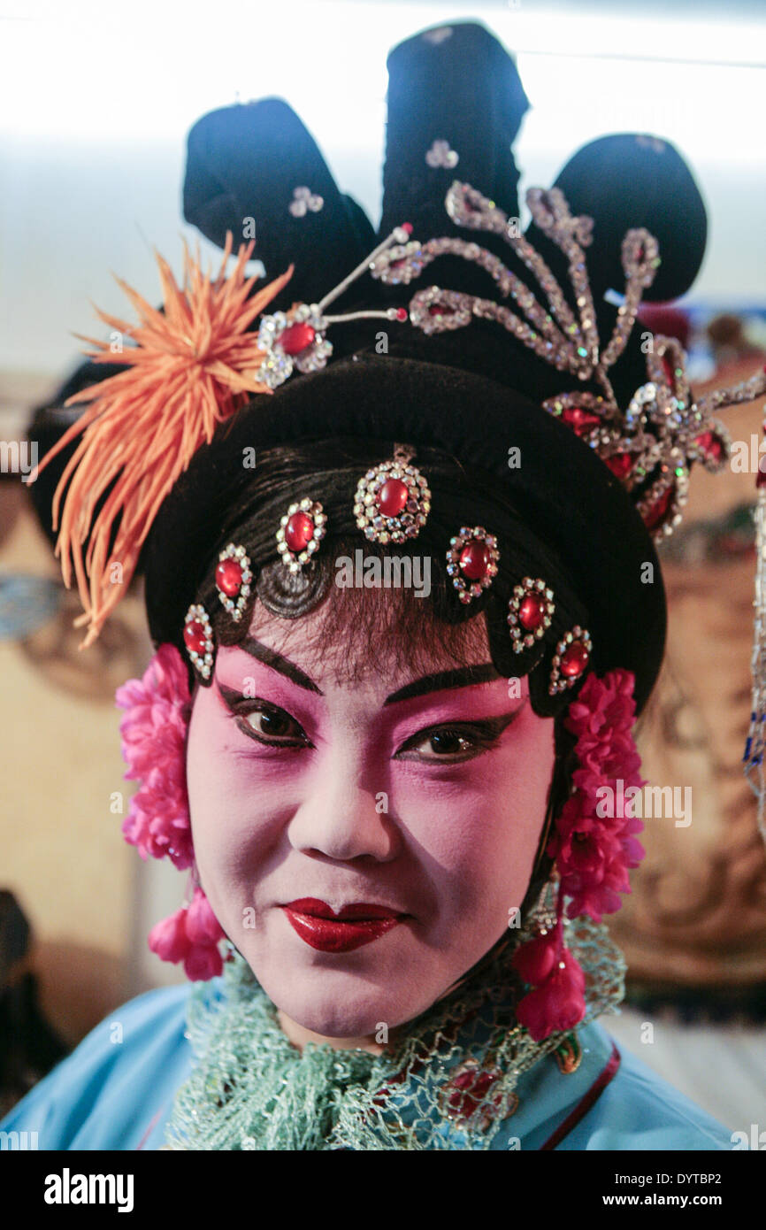 Chinese traditional opera artists pose for a picture before their daily ...