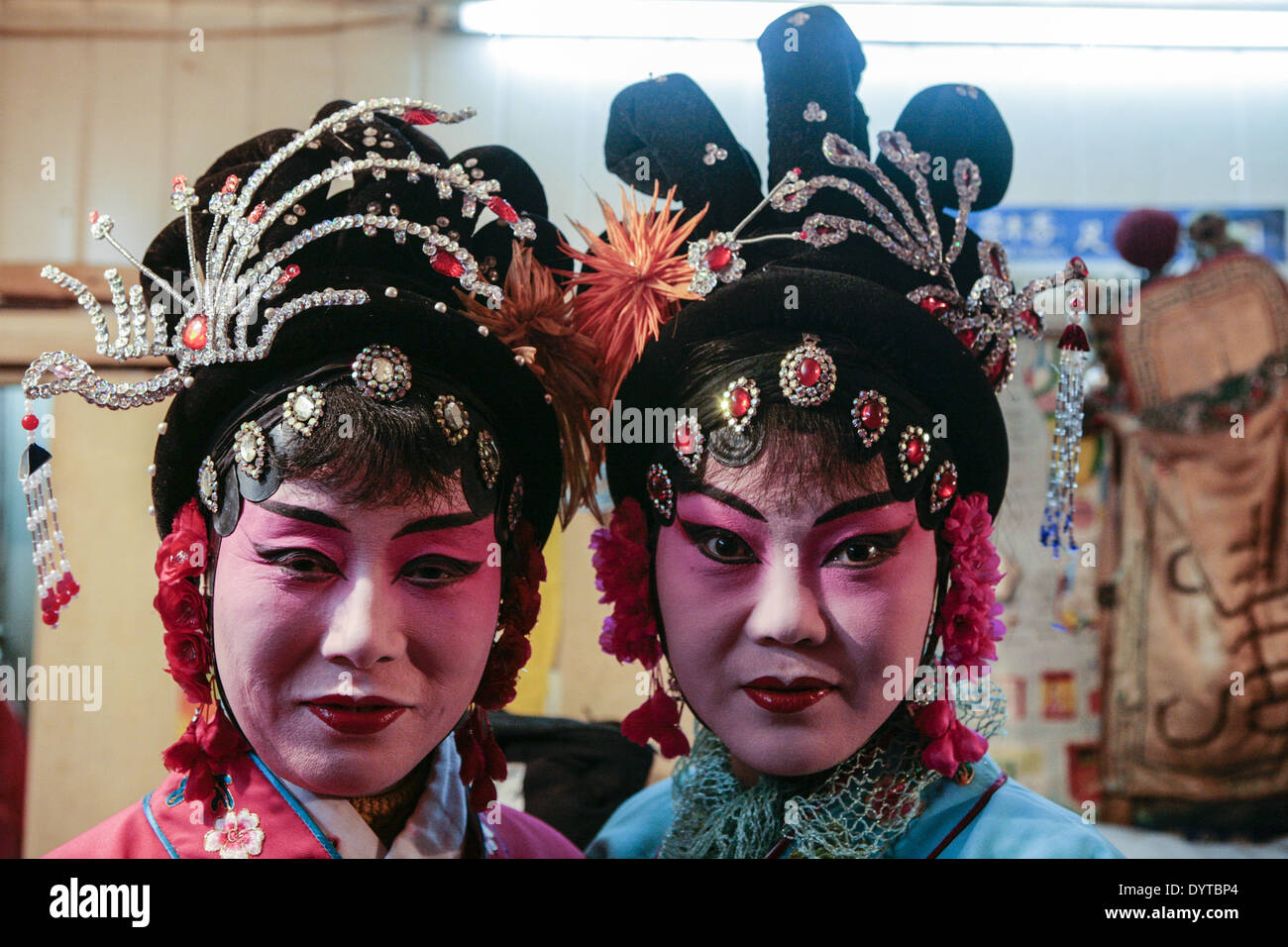 Chinese traditional opera artists pose for a picture before their daily ...