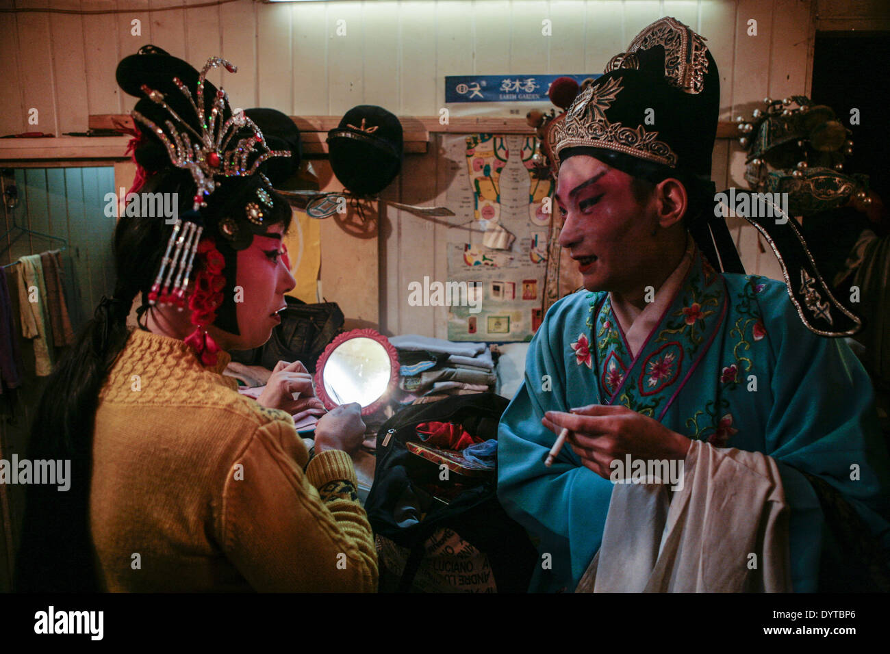 Chinese traditional opera artists pose for a picture before their daily ...