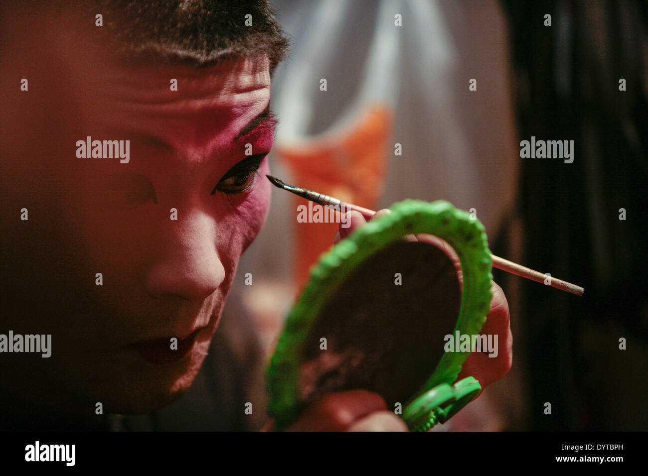 Chinese traditional opera artists do their makeup before their daily ...