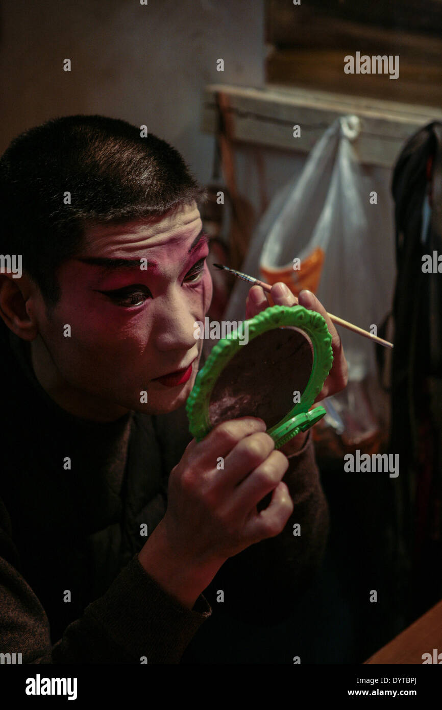 Chinese traditional opera artists do their makeup before their daily ...