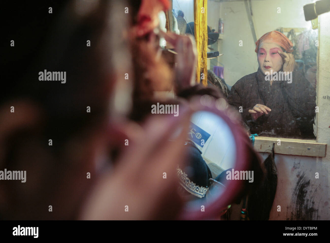 Chinese traditional opera artists do their makeup before their daily ...