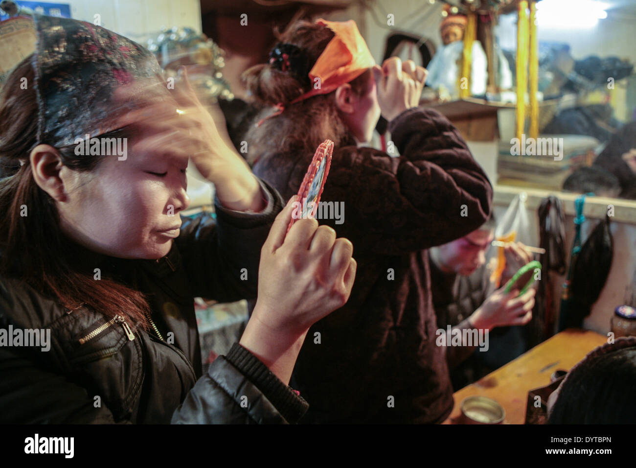 Chinese traditional opera artists do their makeup before their daily ...