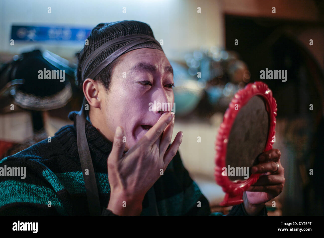 Chinese traditional opera artists do their makeup before their daily ...