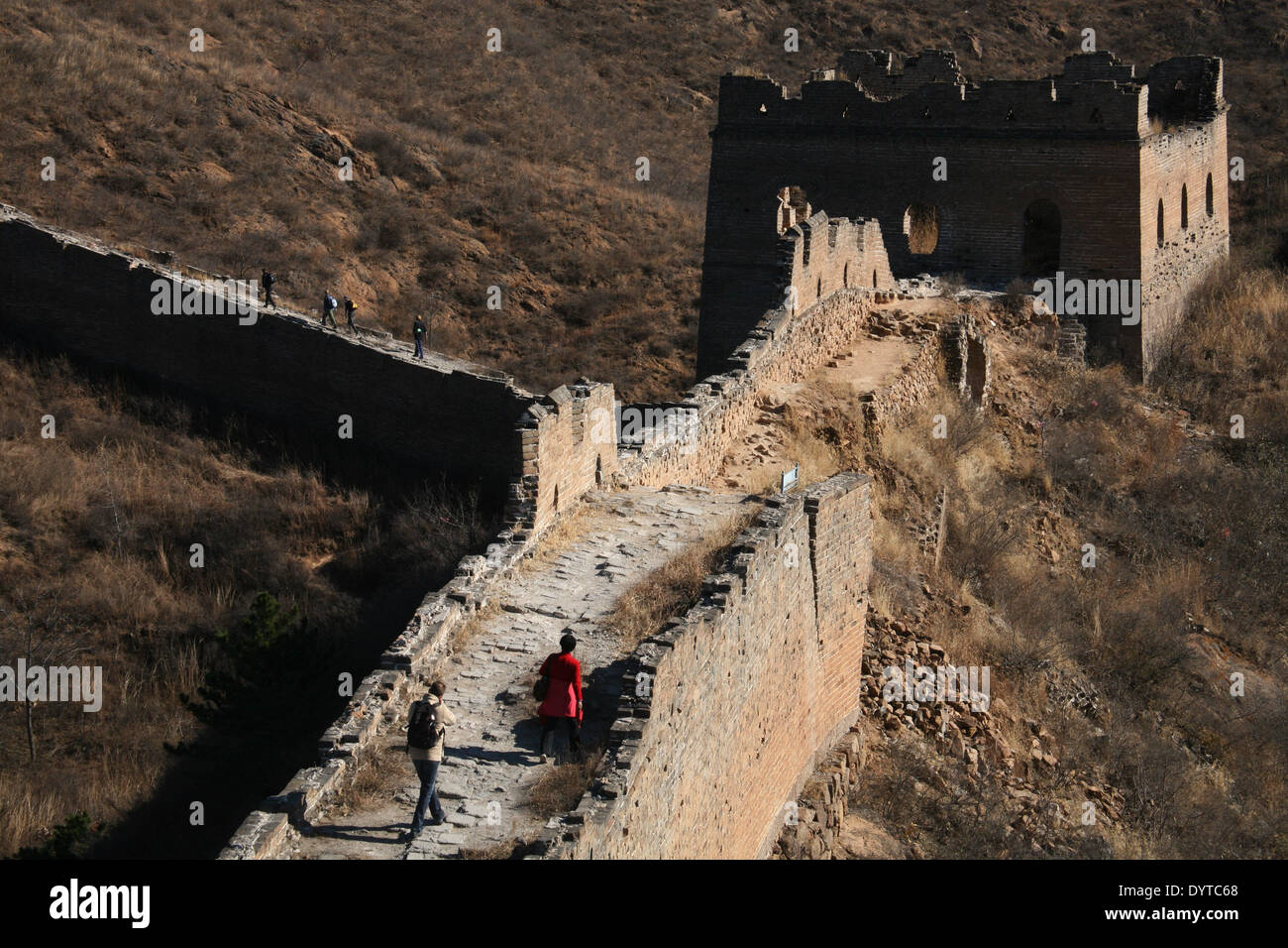 Visitors walk on the broken Jin Shan Lin section of Great Wall at the ...