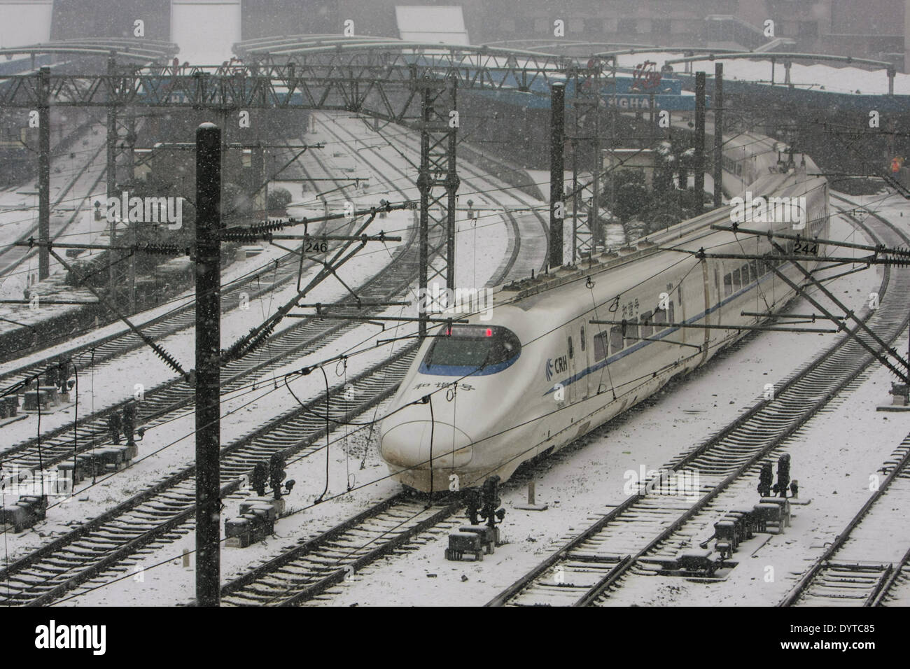 High speed train leaves station under snow in shanghai hi-res stock ...