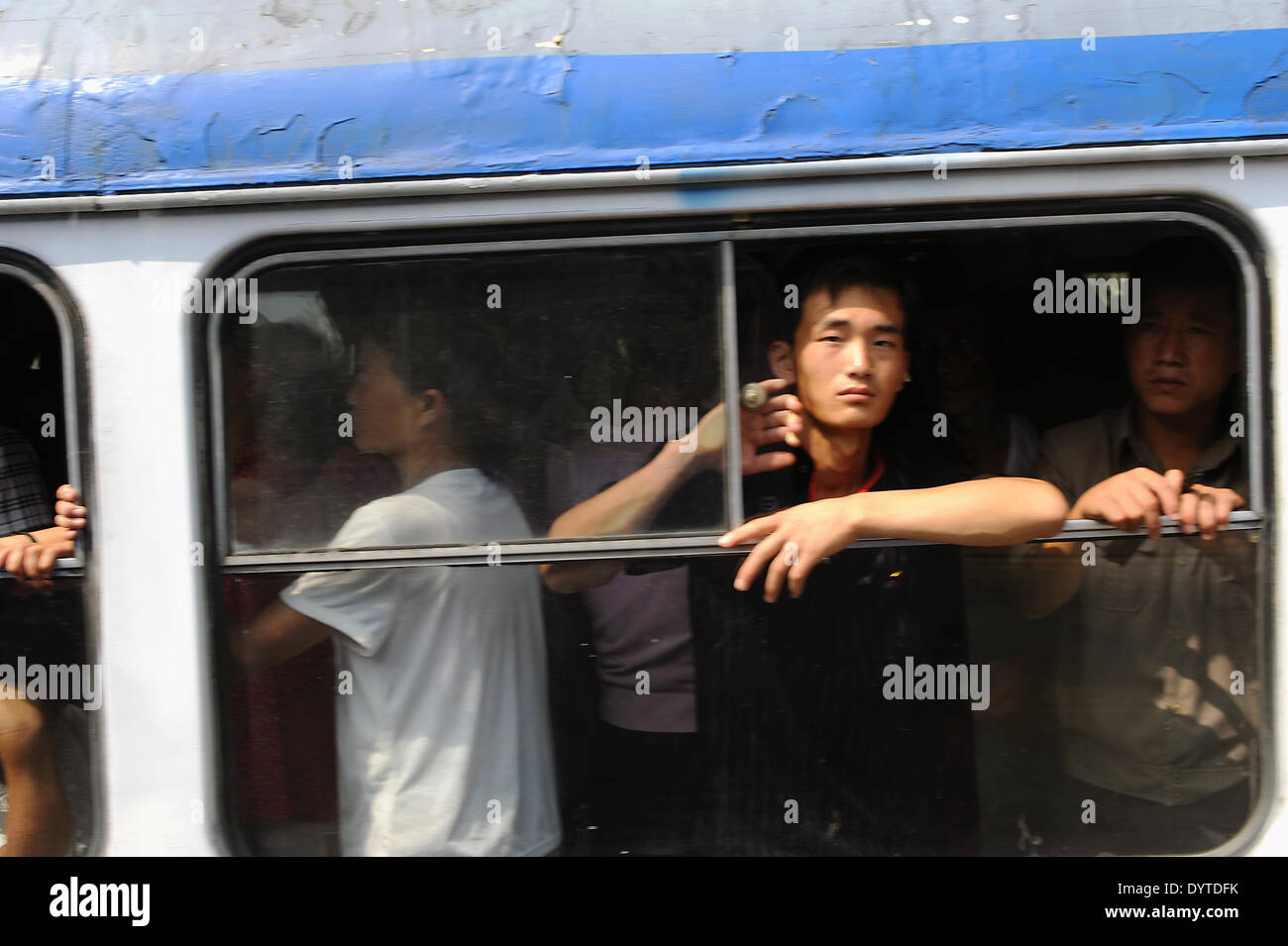 Bus passengers looking out of window hi-res stock photography and ...