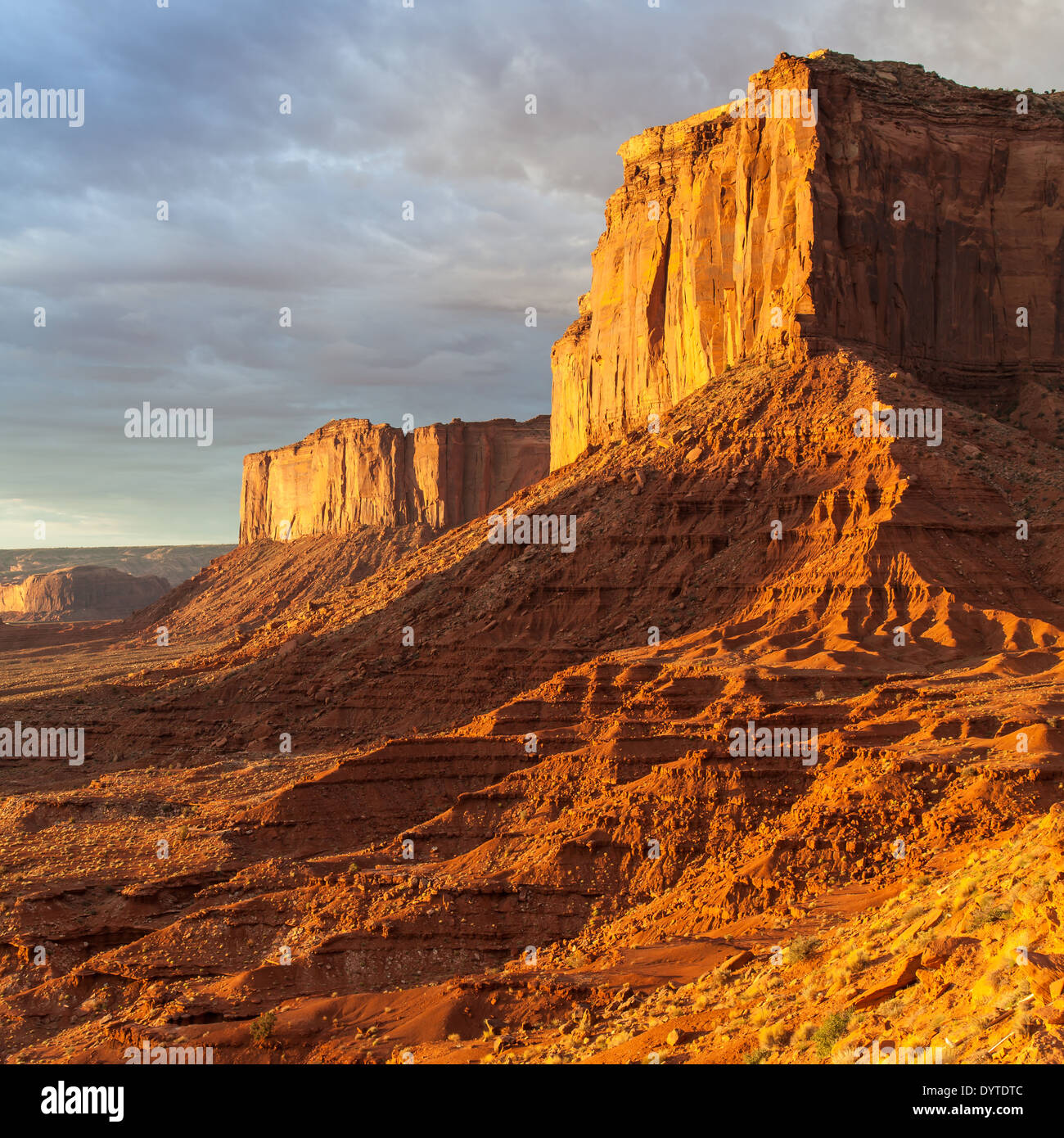 Orange colours during sunrise in this iconic view of Monument Valley ...