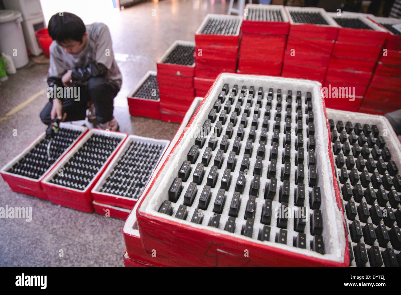 Workers make lighters at a factory Stock Photo - Alamy