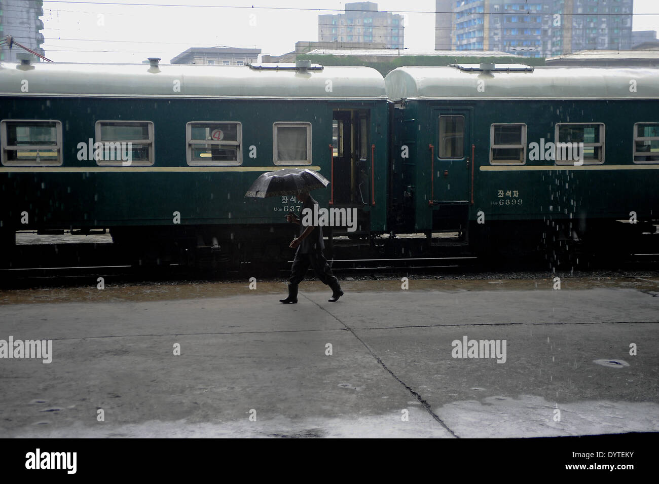 Rain at the train station Stock Photo - Alamy