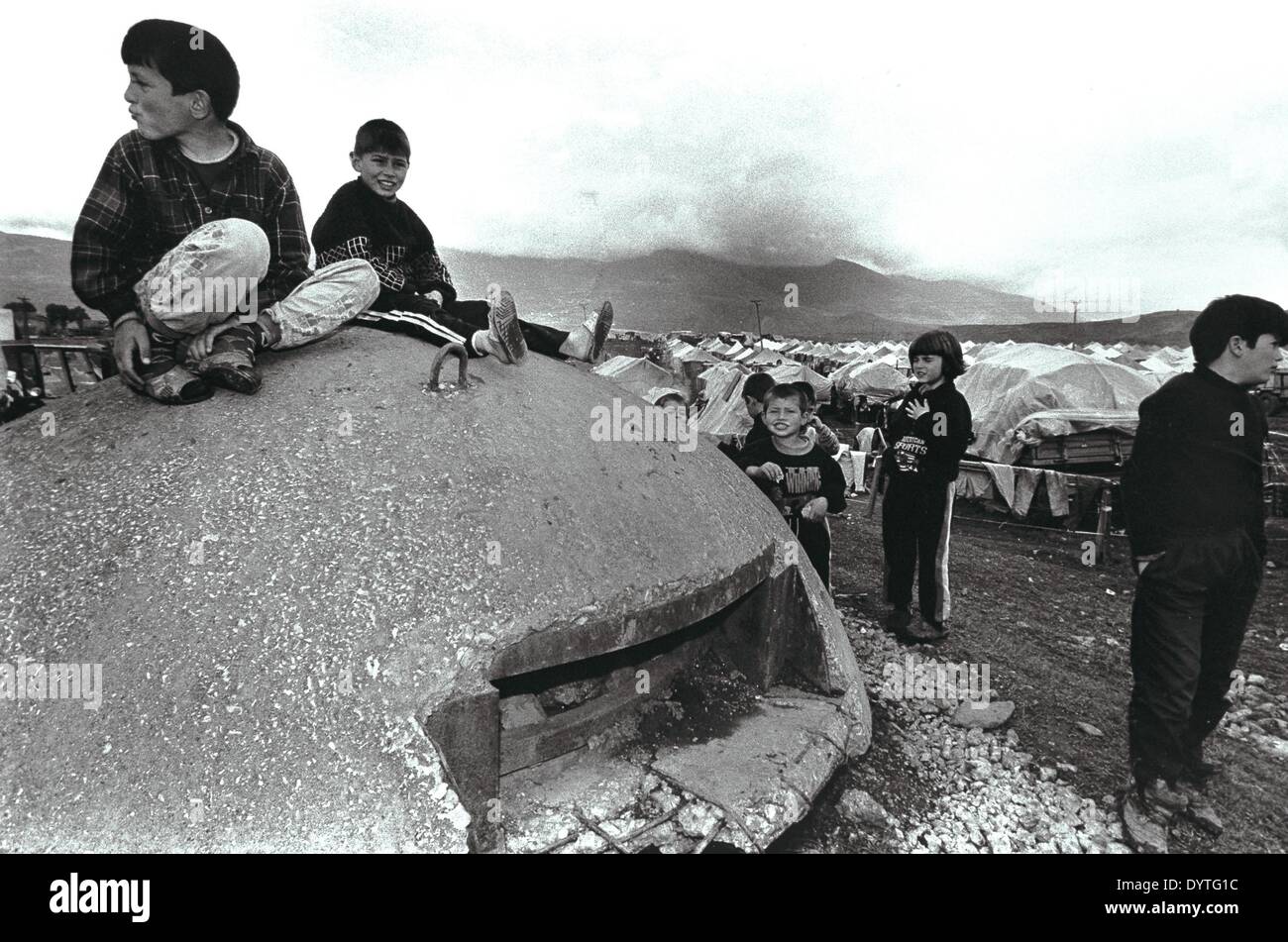 Refugee children play near hi-res stock photography and images - Alamy