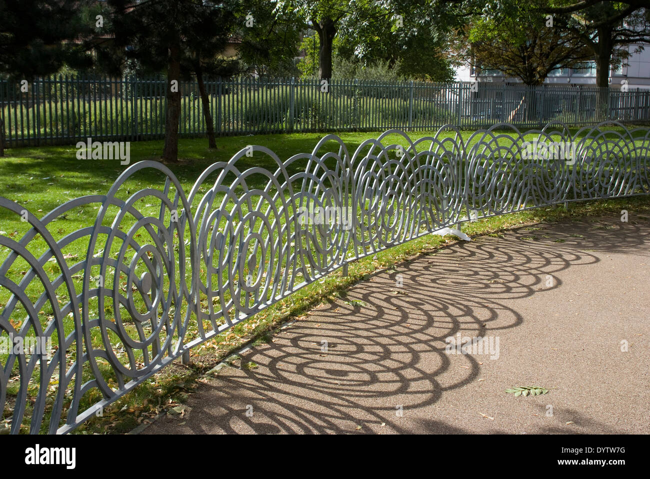 Patterns in an iron fence along the towpath of the Regent's Canal, near ...