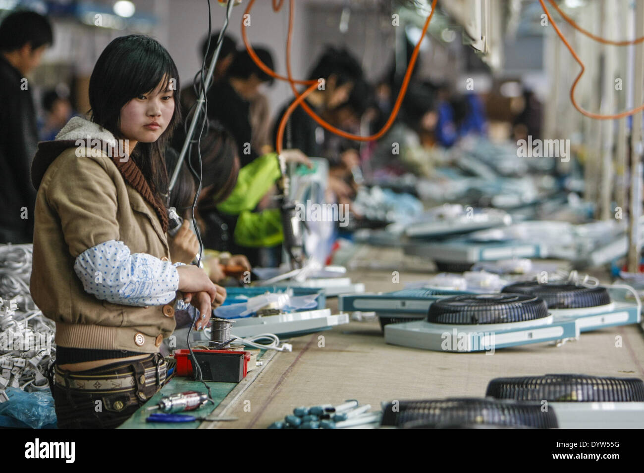 Workers works at a assembly line in Baoerma Electric Appliance Co Stock ...