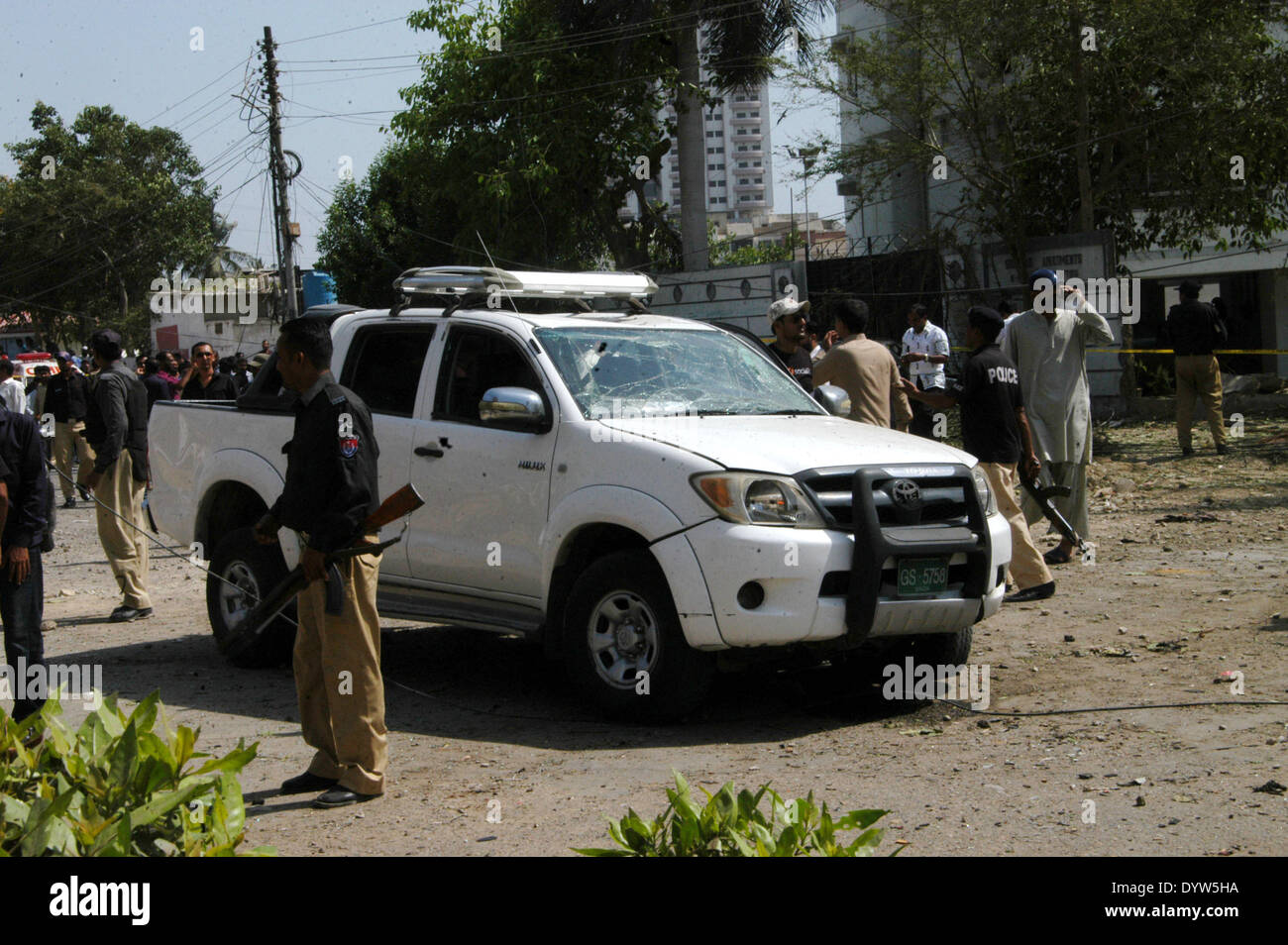 Karachi. 25th Apr, 2014. A damaged vehicle is seen at the blast site in ...
