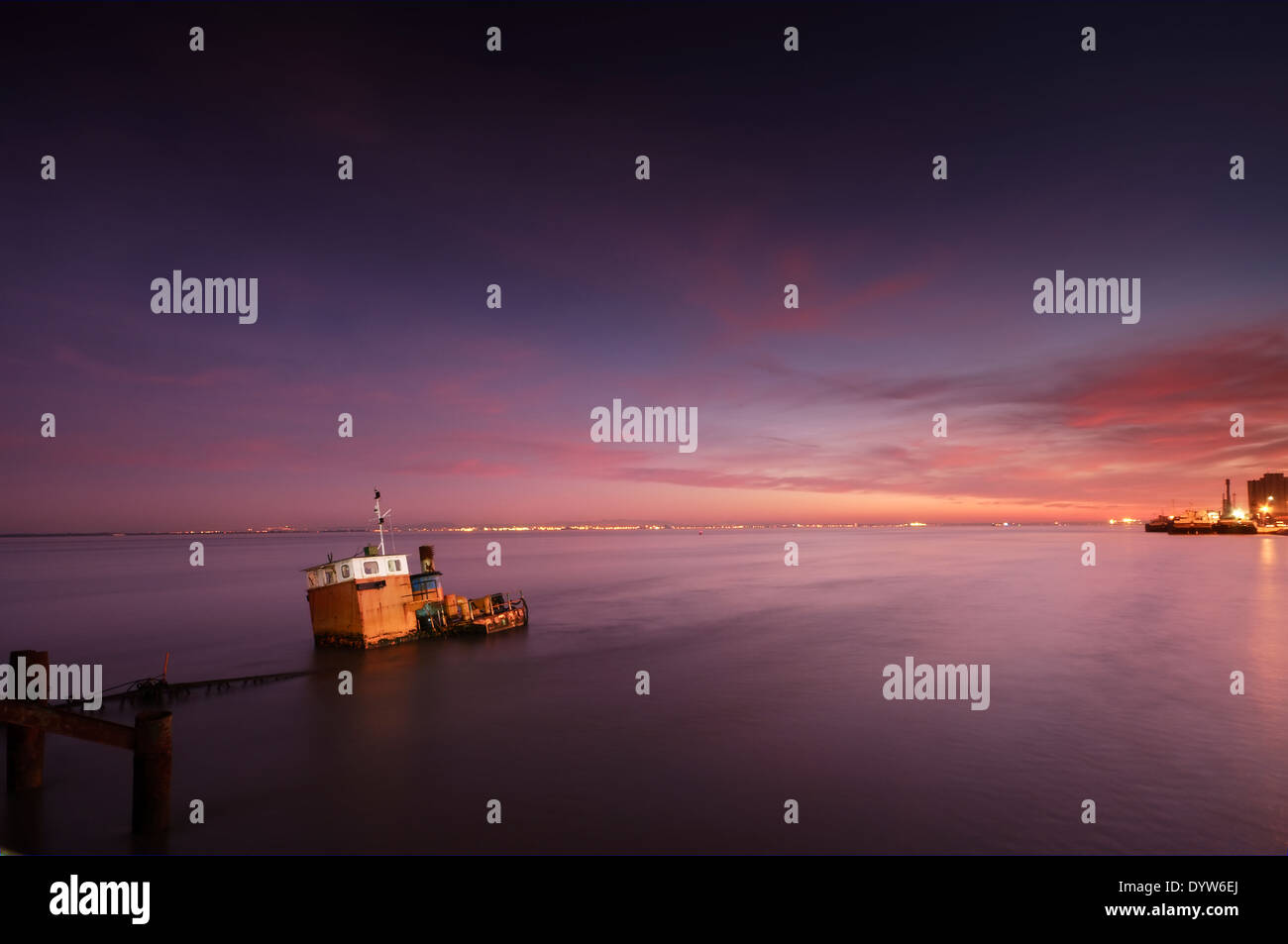 Small sunken ship at Lisbon's industrial area Stock Photo - Alamy