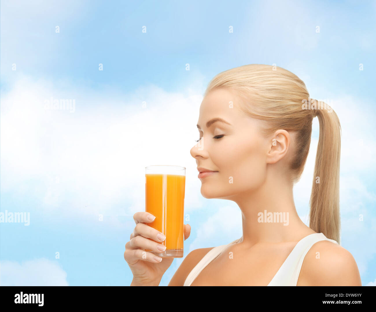 Woman smelling orange fruit hi-res stock photography and images - Alamy