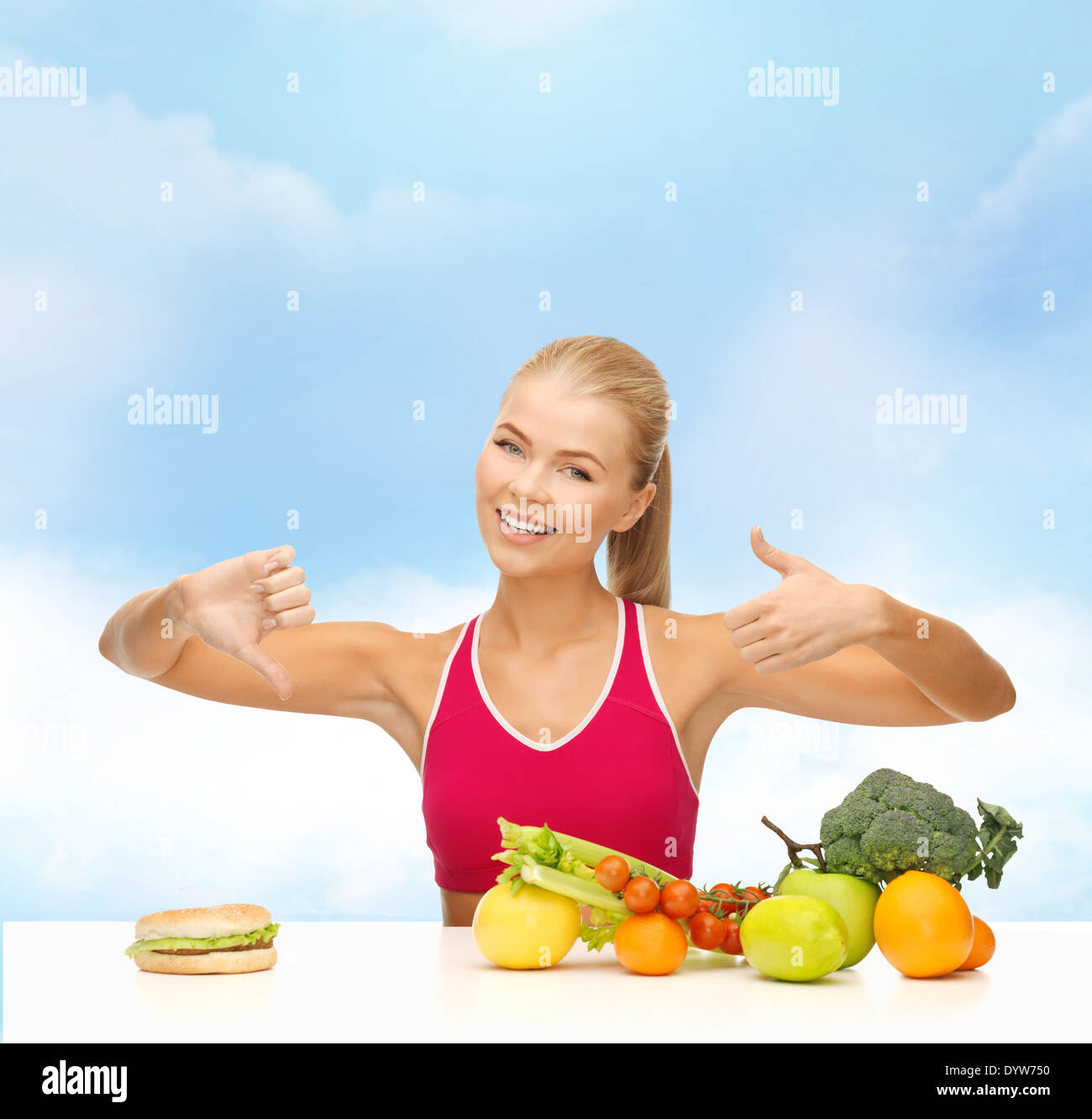 woman with fruits and hamburger comparing food Stock Photo - Alamy