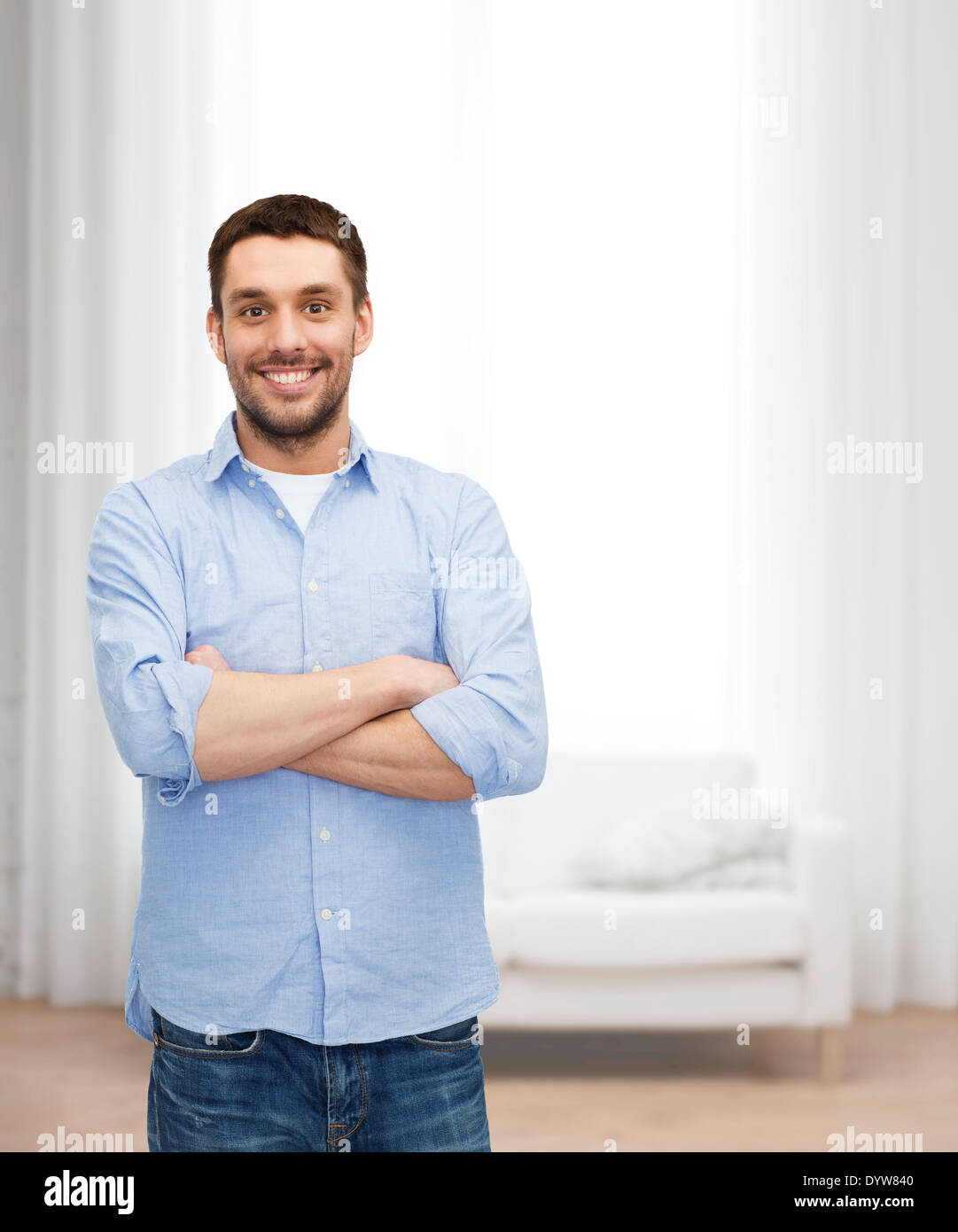 smiling man with crossed arms Stock Photo - Alamy