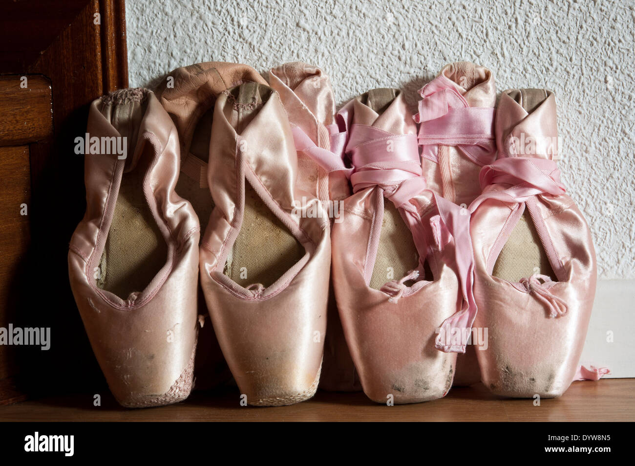 Group of pointe shoes leaned against the wall Stock Photo - Alamy