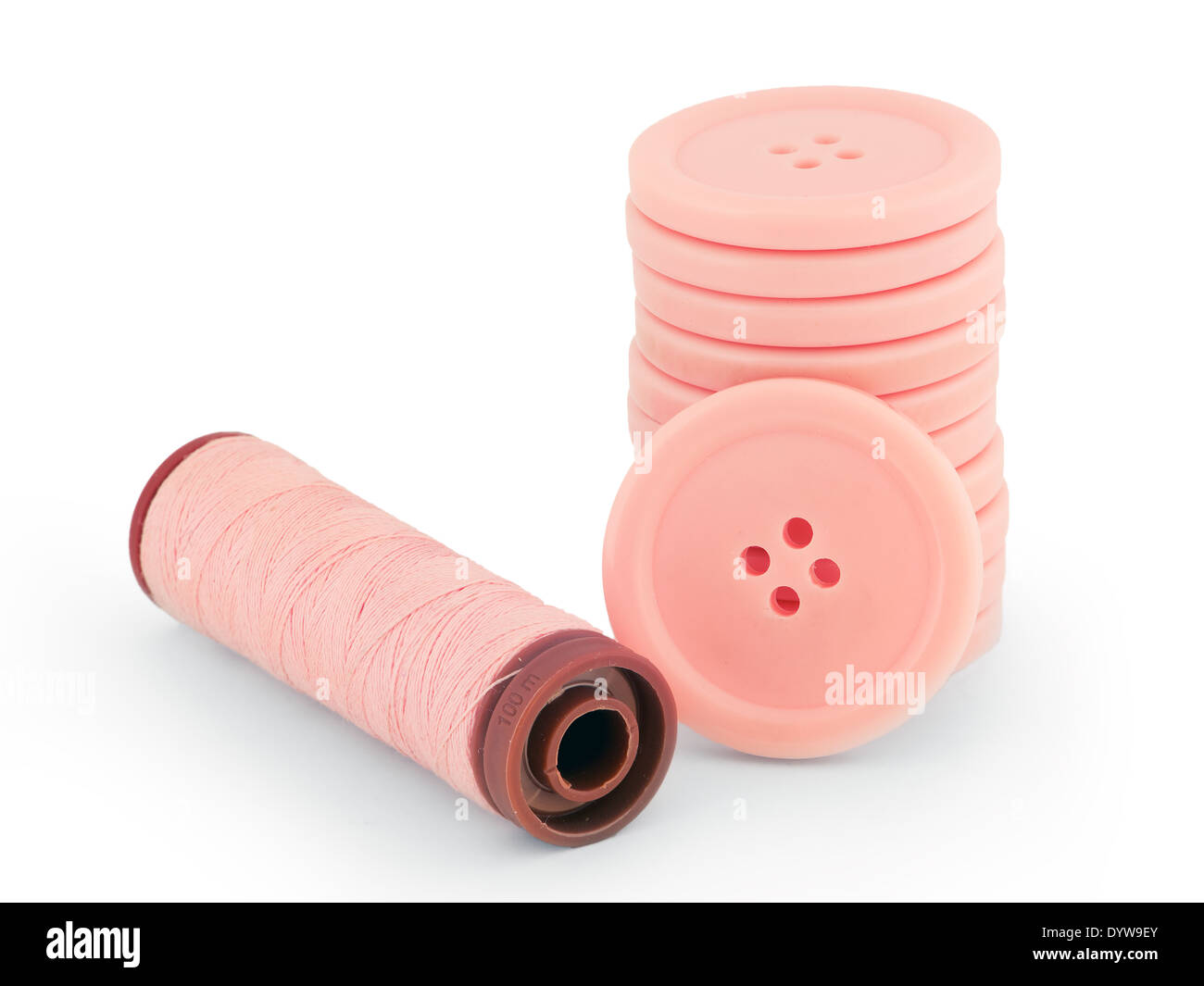 pink sewing buttons and thread isolated on white Stock Photo - Alamy