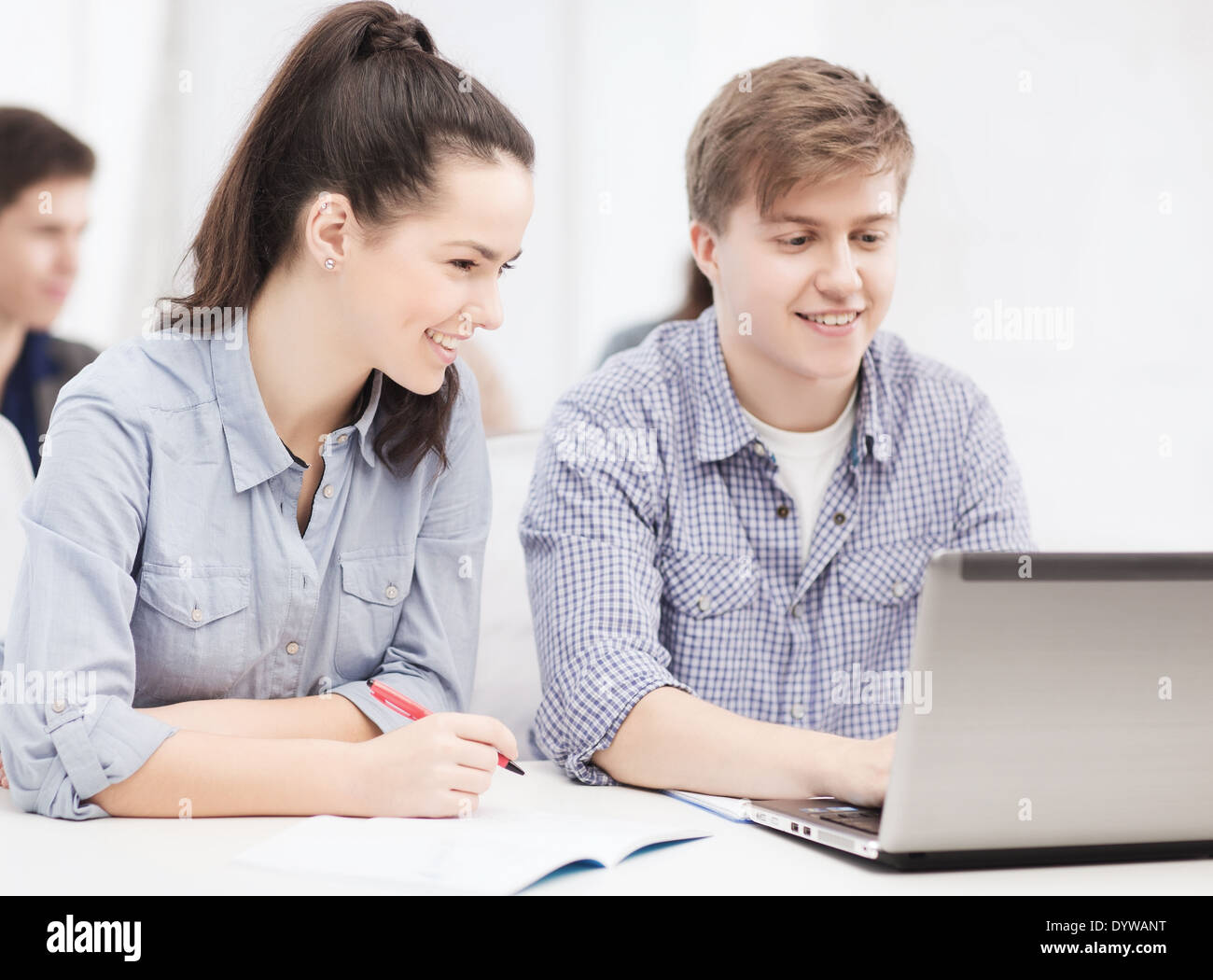 students with laptop and notebooks at school Stock Photo - Alamy